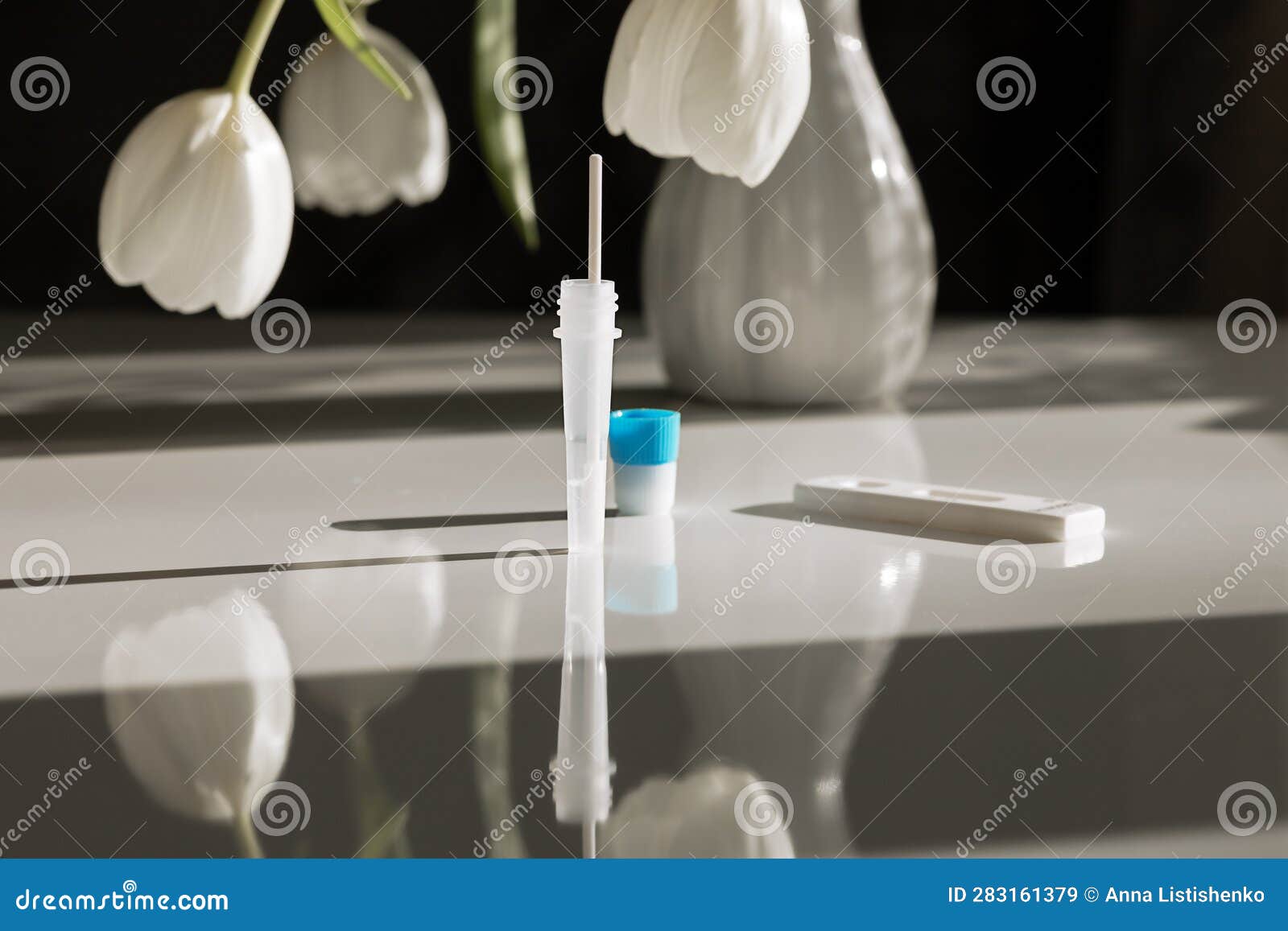Tablet and Covid and Disease Test Kit Next To the Tulip on White ...