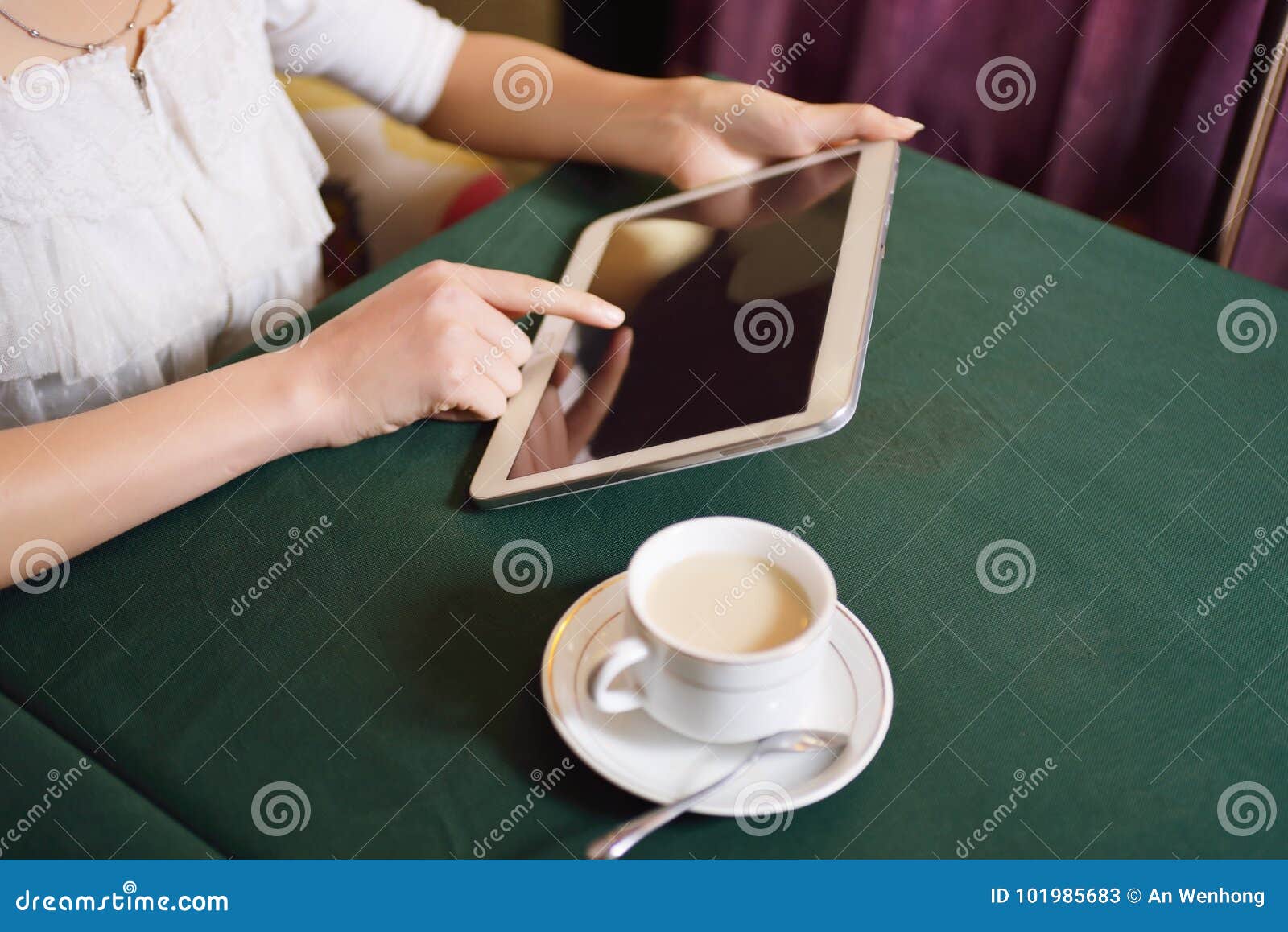 Tablet and a cup of coffee stock image. Image of fingers - 101985683