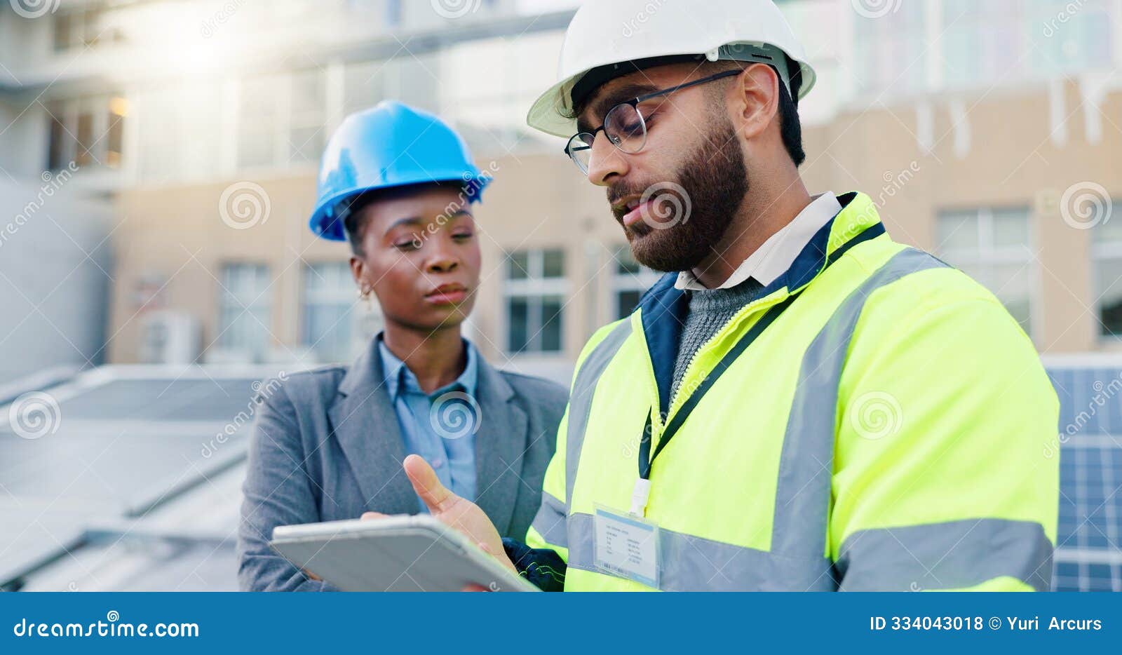 Tablet, Discussion and Construction Team on Rooftop Site for City ...