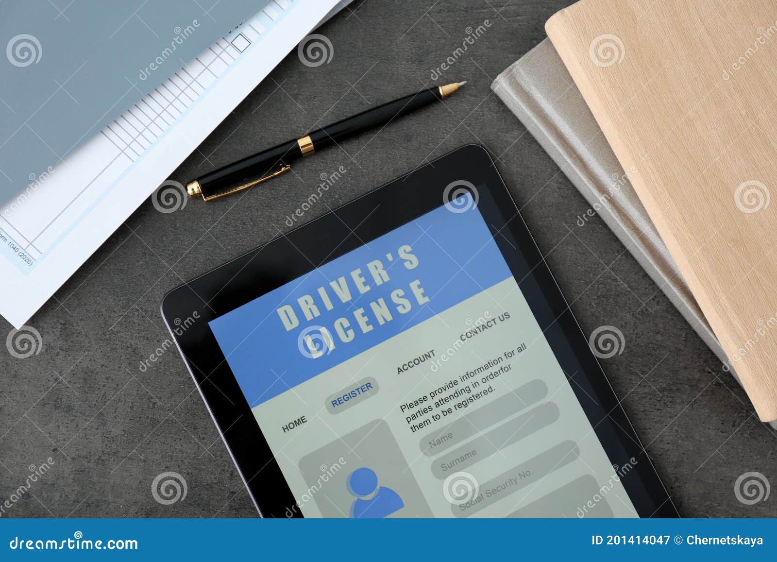 Tablet with Driver`s License Application Form and Stationery on Grey ...