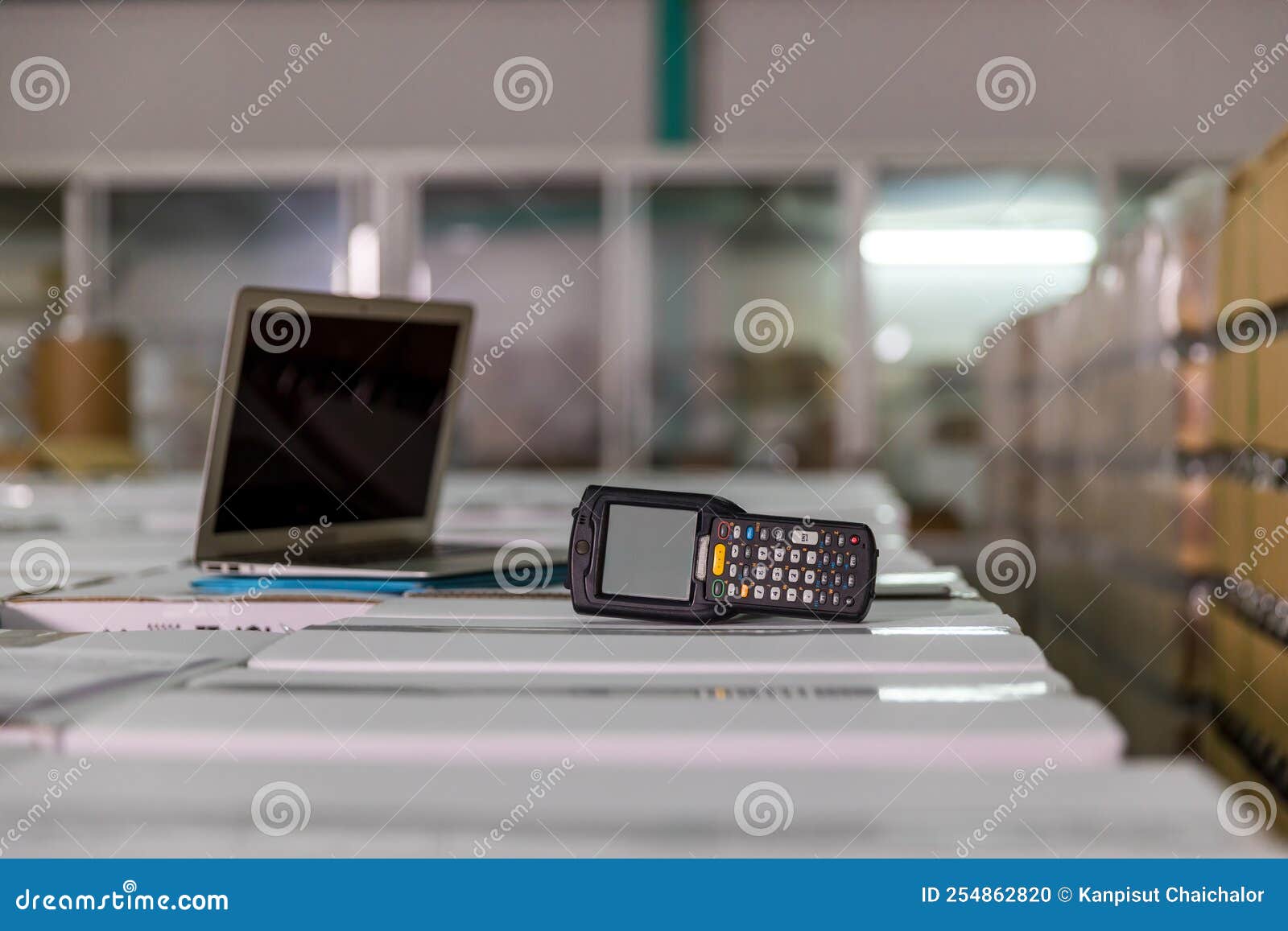 A Tablet Handheld in Warehouse. Electronic Gadgets on the Desktop ...