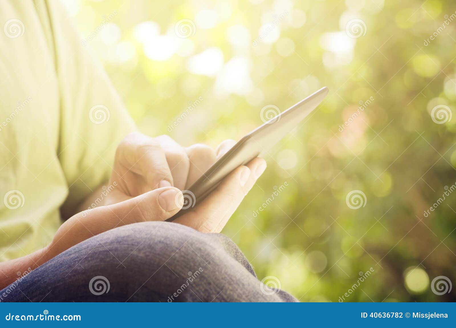 Tablet in hands stock photo. Image of display, grass - 40636782