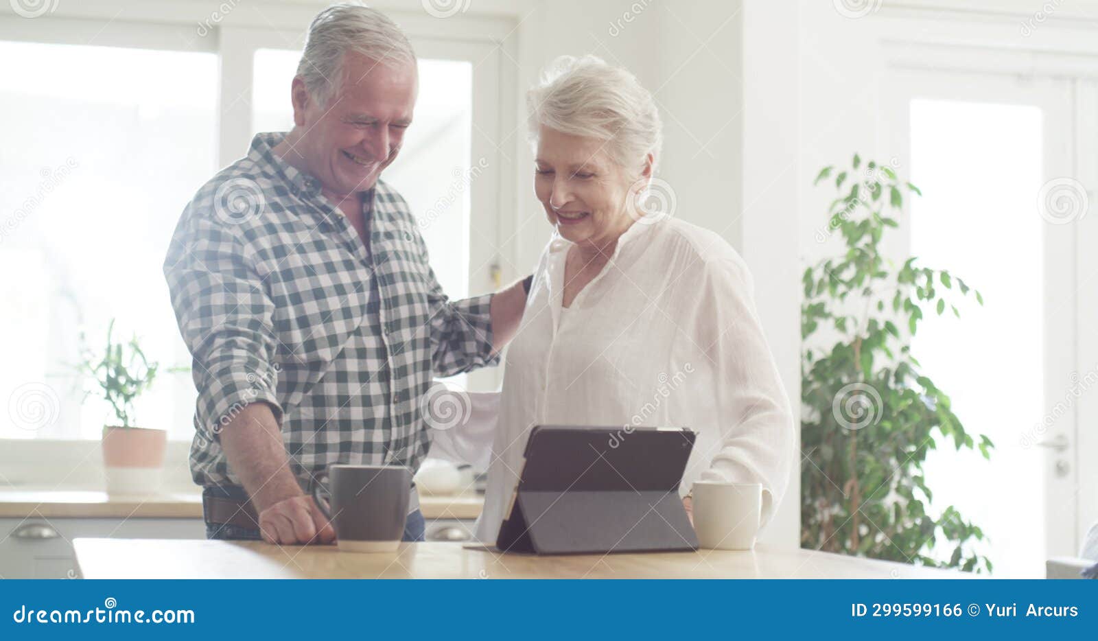 Tablet Kitchen And Senior Happy Couple Reading Online Retirement News