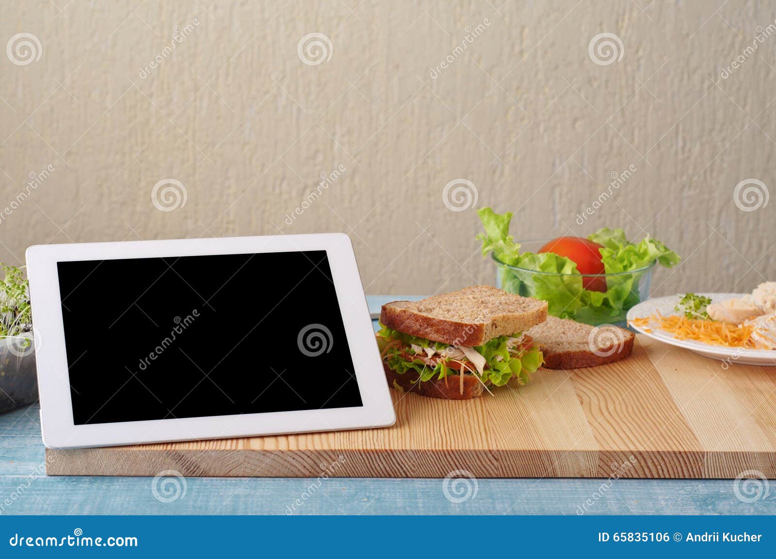 Tablet on the Kitchen Table with Chicken Sandwiches Stock Photo - Image ...