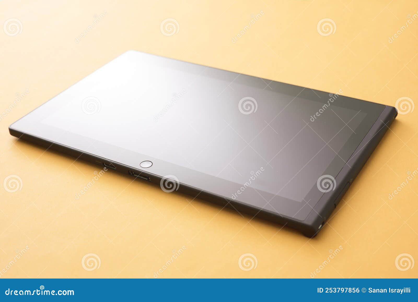 Tablet Mobile Device with Blank Black Screen Close-up on Yellow Surface ...