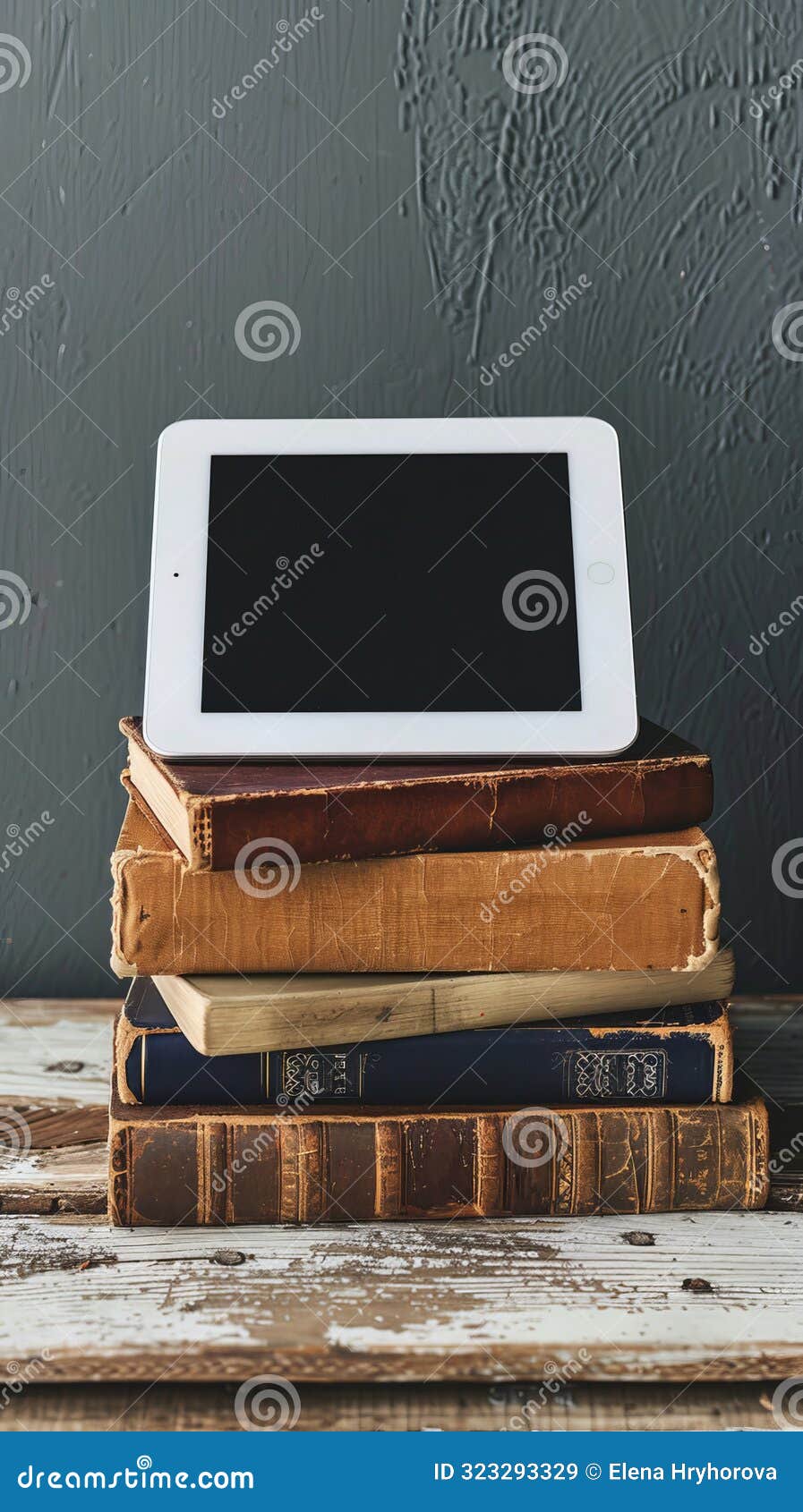 Tablet on Old Books, Representing the Blend of Technology and ...
