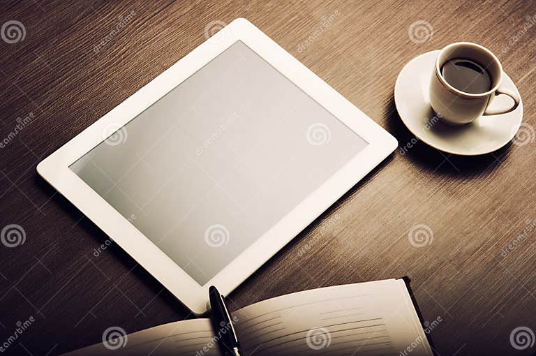 Tablet Pc and a Coffee and Notebook with Pen on the Office Desk Stock ...