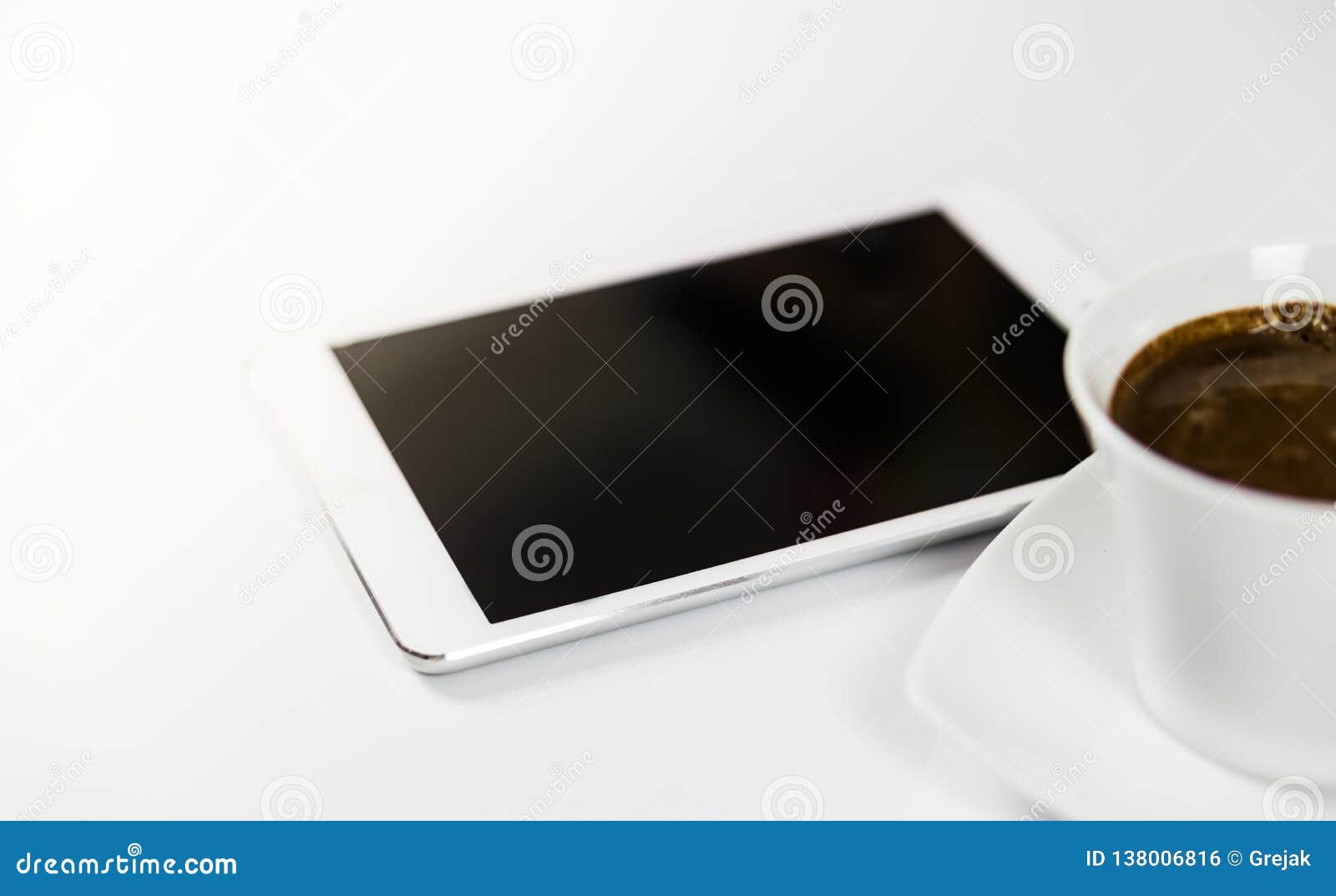 Computer Tablet with Empty Screen Next To Coffee. the Tablet is on the ...