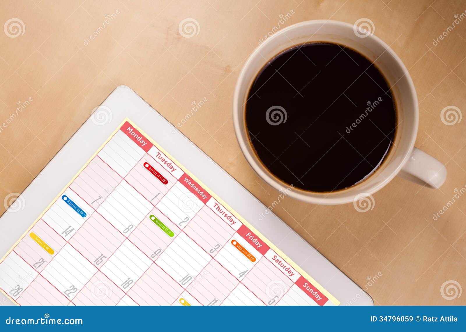 Tablet Pc Showing Calendar on Screen with a Cup of Coffee on a D Stock ...