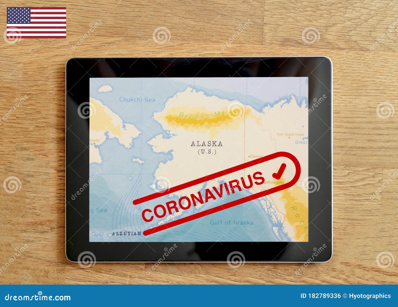A Tablet PC Which is Displayed with Map of Alaska and Coronavirus Text ...