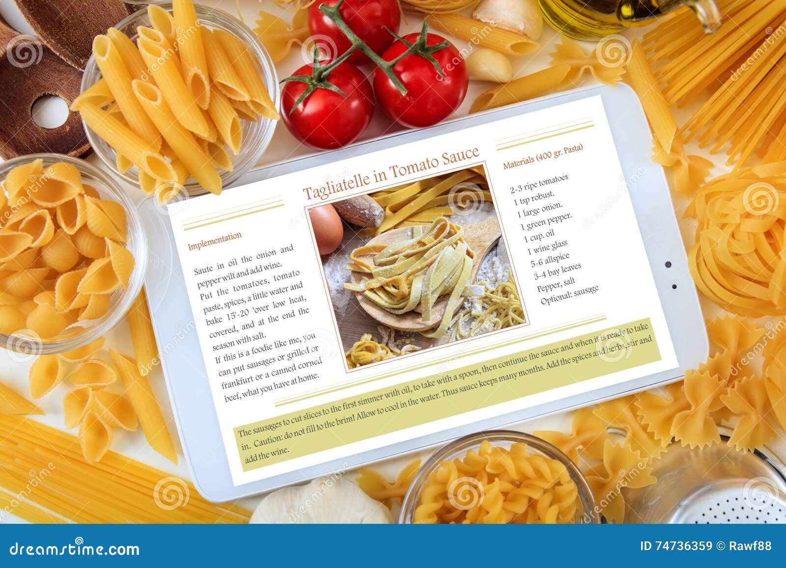 Tablet with Recipe on a Table with Pasta and Vegetables Stock Image ...