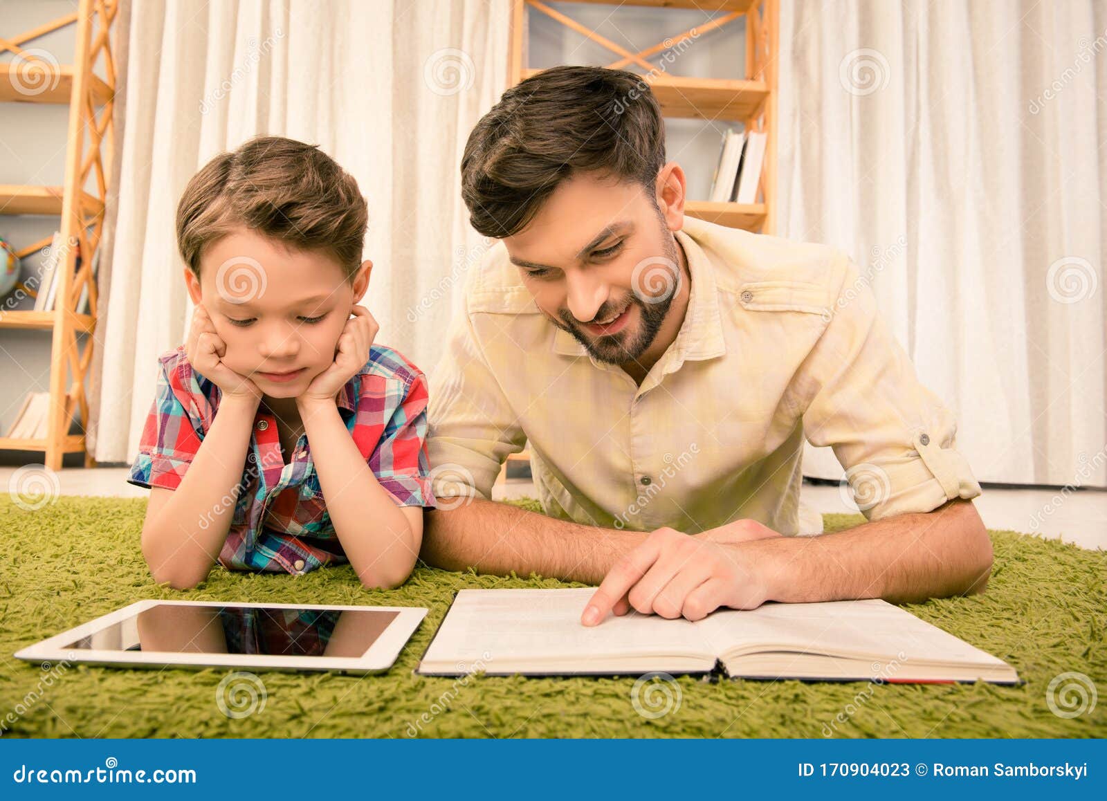 Tablet Vs Book. Father and His Little Son Reading Stock Image - Image ...