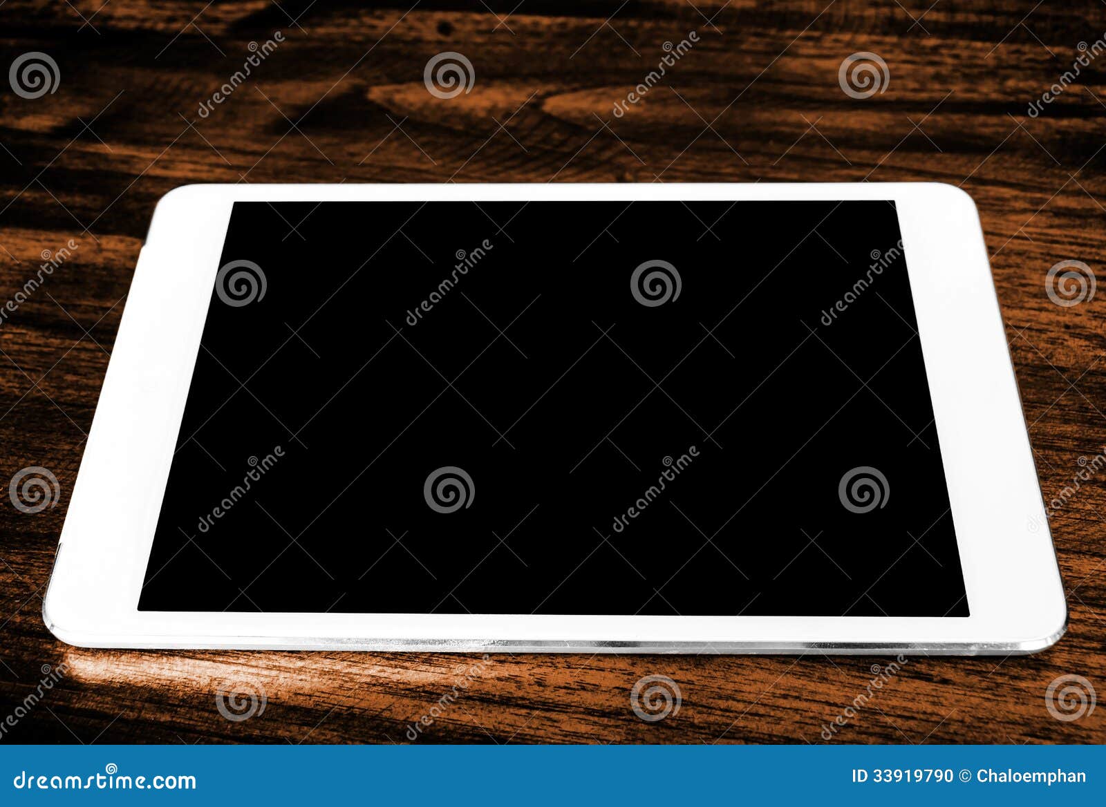 Tablet on wood table stock photo. Image of monitor, display - 33919790