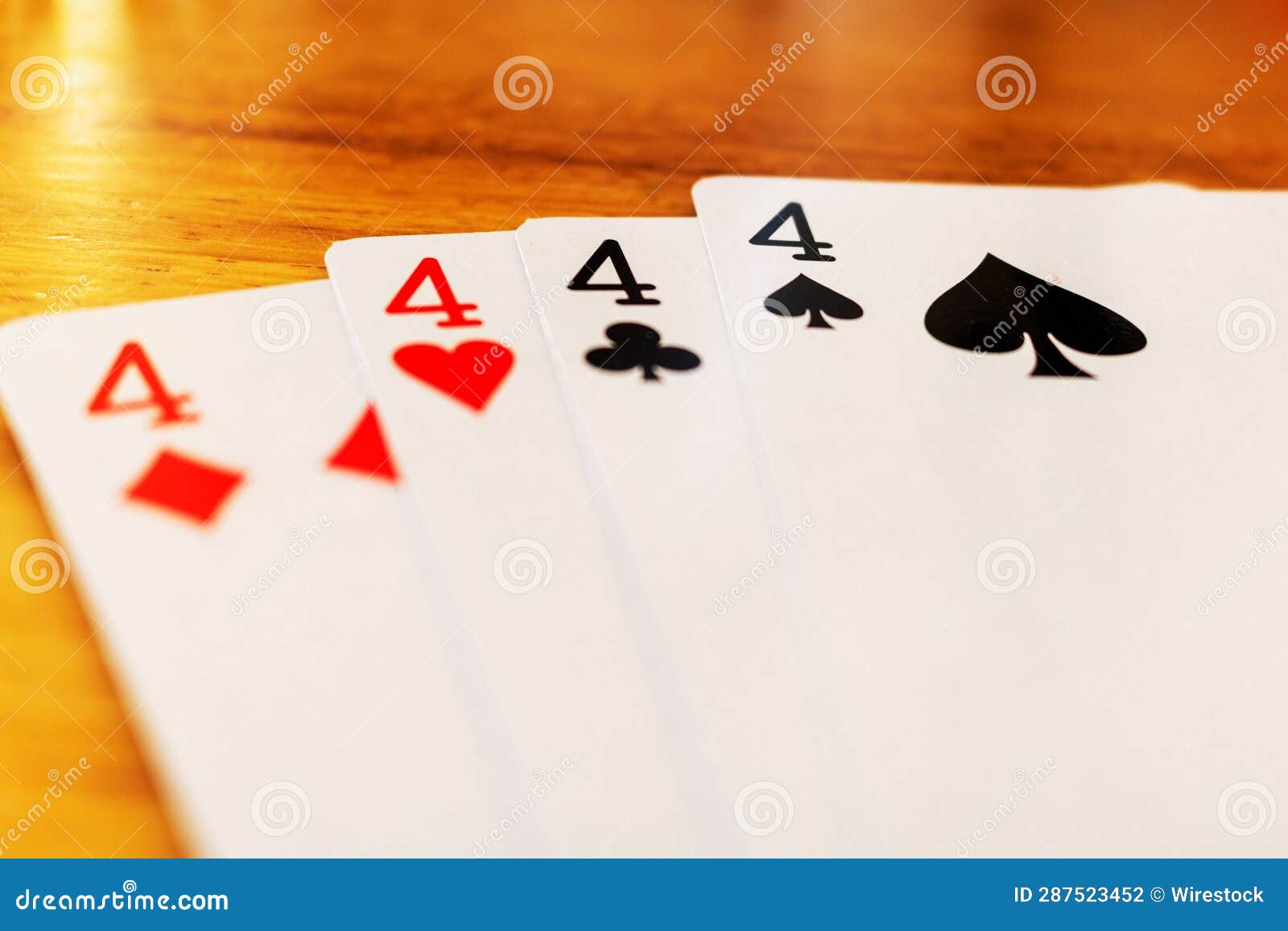 Tabletop with Four Card Suits Arranged in an Alternating Pattern Stock ...