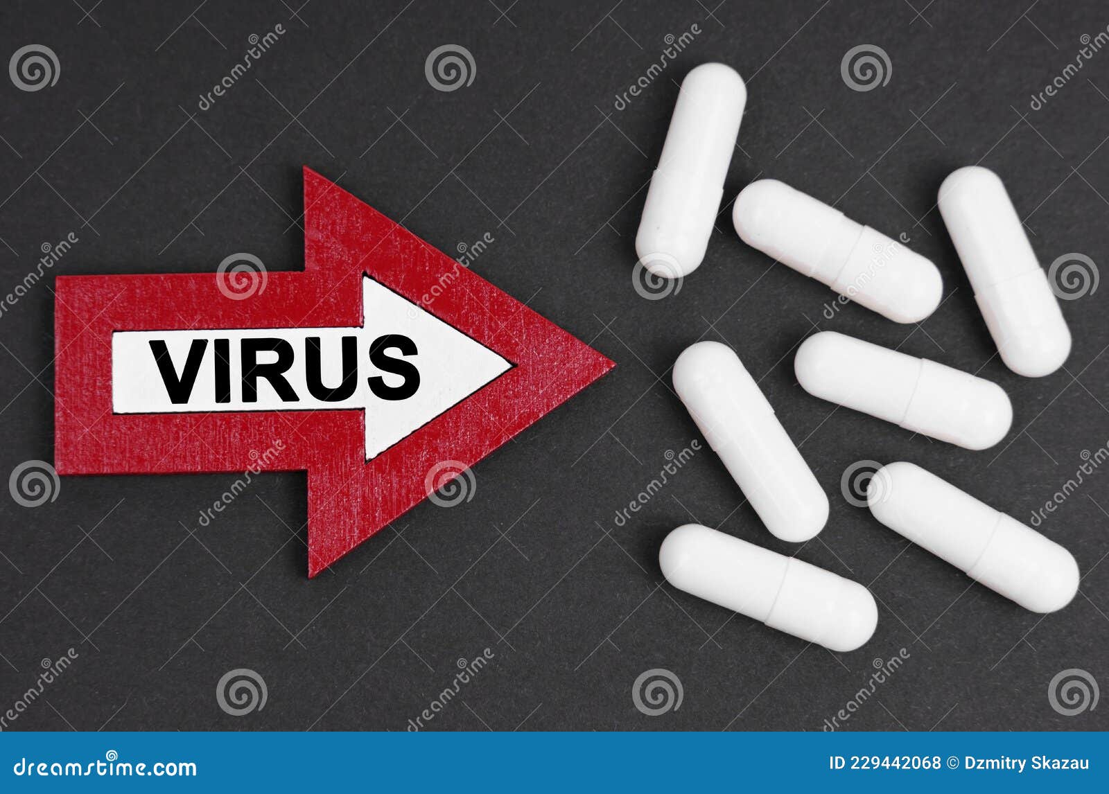 Tablets are on a Black Background. they are Indicated by an Arrow on ...