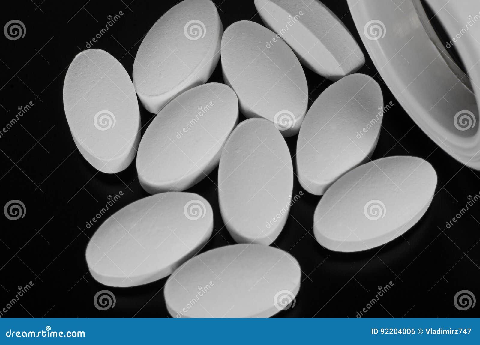 Tablets on black surface stock photo. Image of treatment - 92204006
