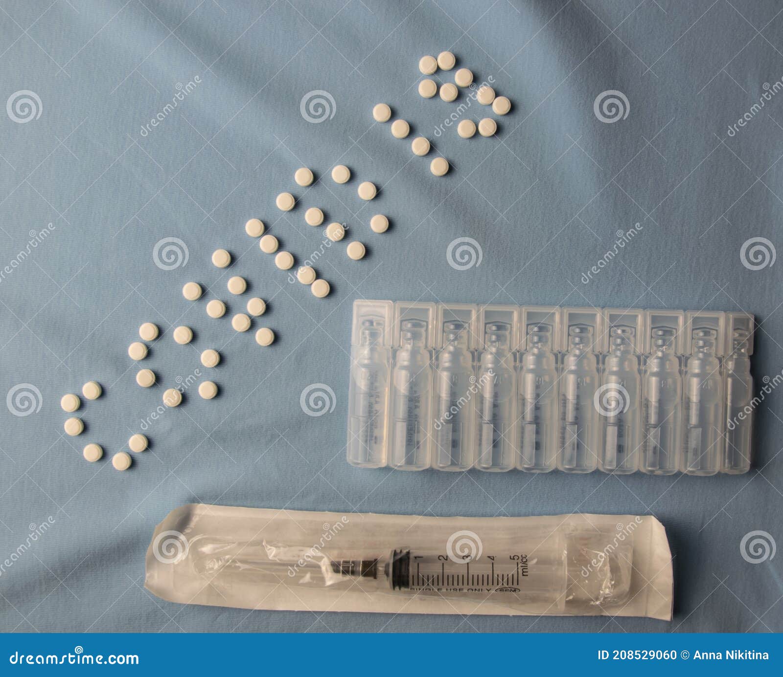 Tablets on a Blue Background. Packed Syringe and Water for Injection ...