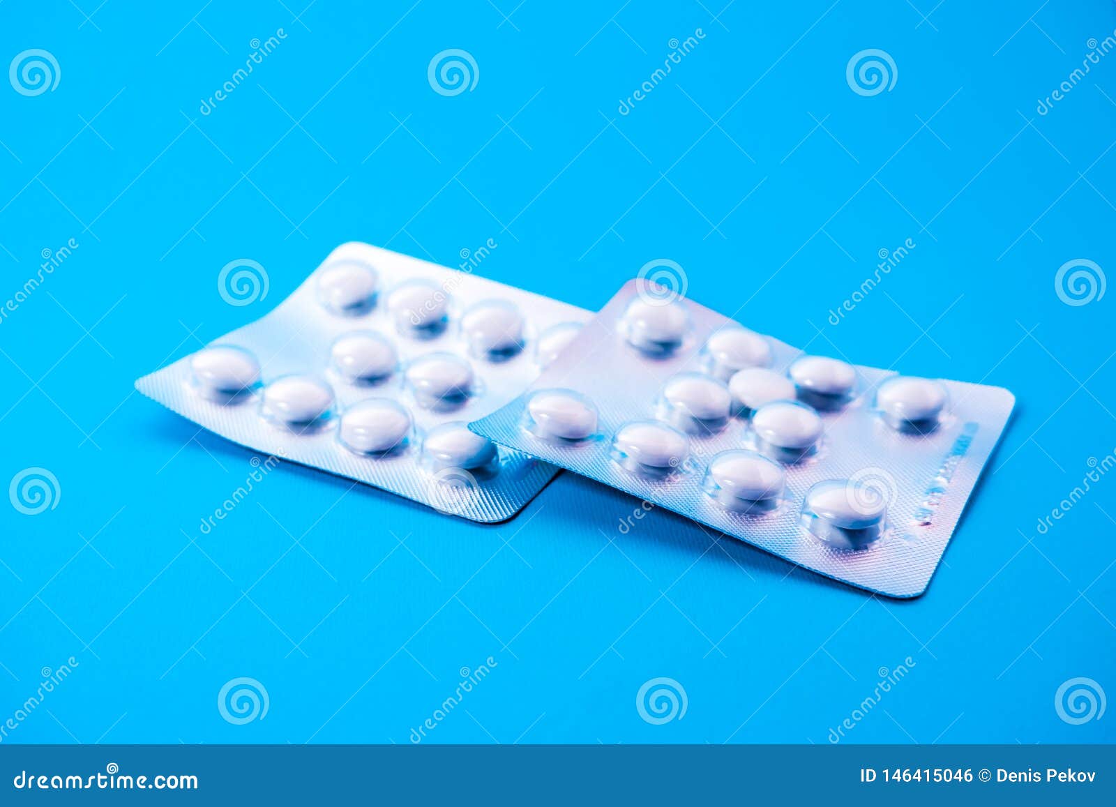 Tablets on a Blue Background Stock Photo - Image of blue, pill: 146415046