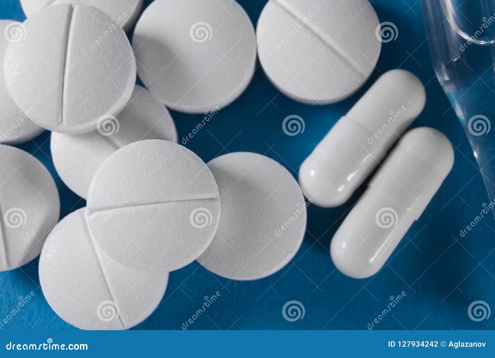 Tablets on the blue table. stock photo. Image of medical - 127934242