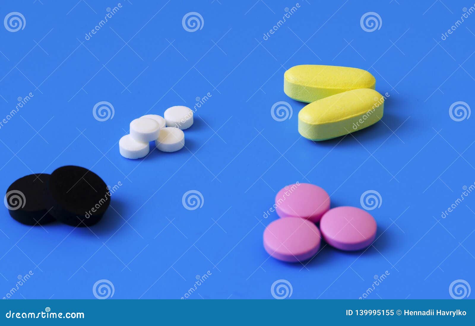 Tablets of Different Colors on a Blue Background Stock Image - Image of ...