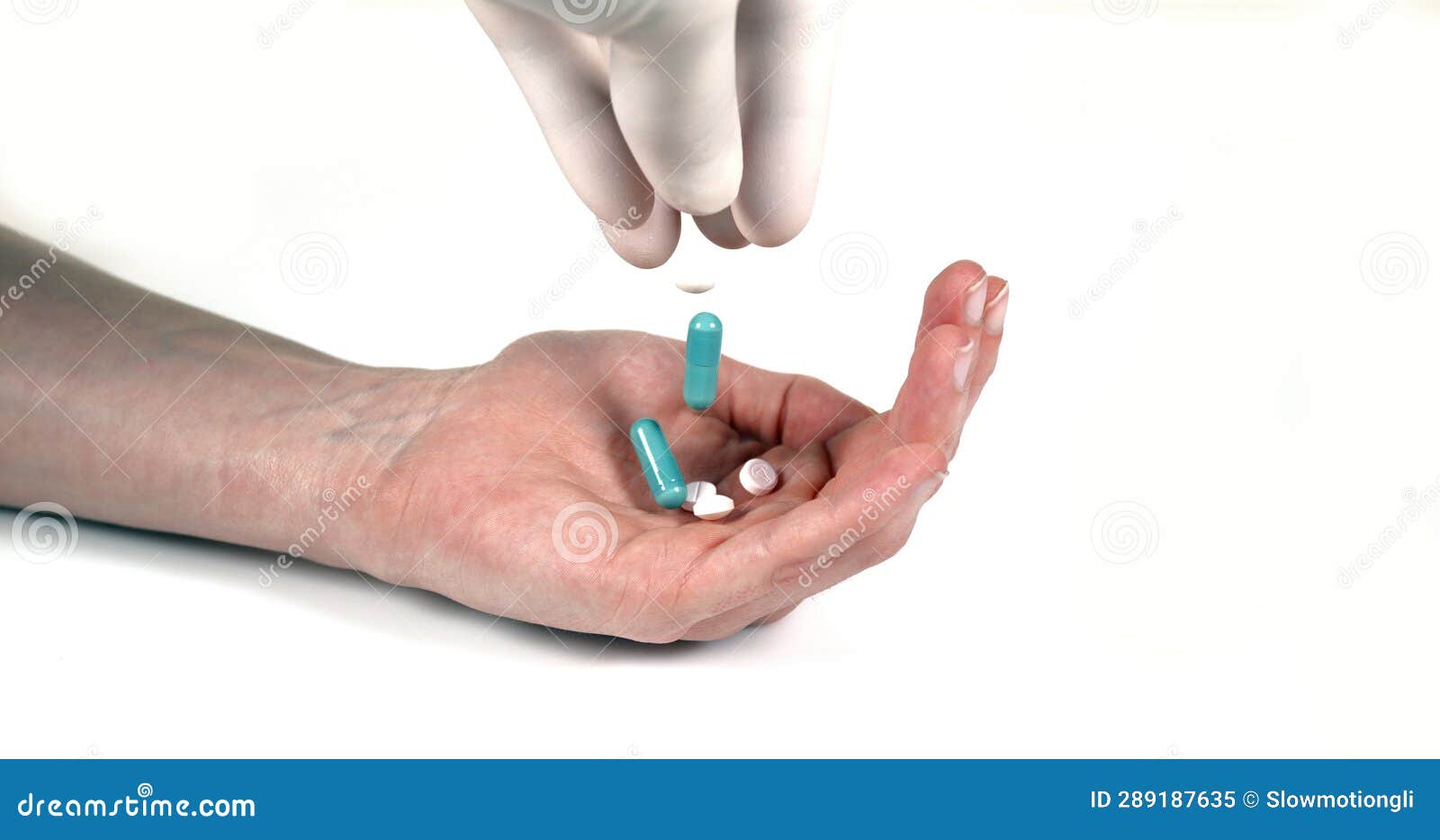 Tablets Falling into Hand Against White Background Stock Image - Image ...
