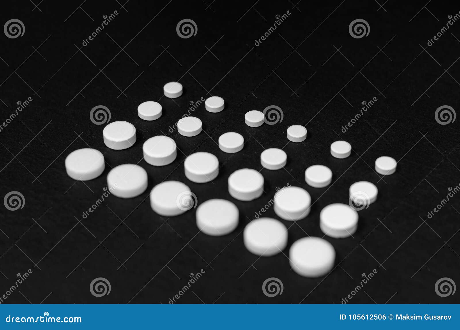 Tablets Lined in Rows on a Black Background, Different Size, Close Up ...