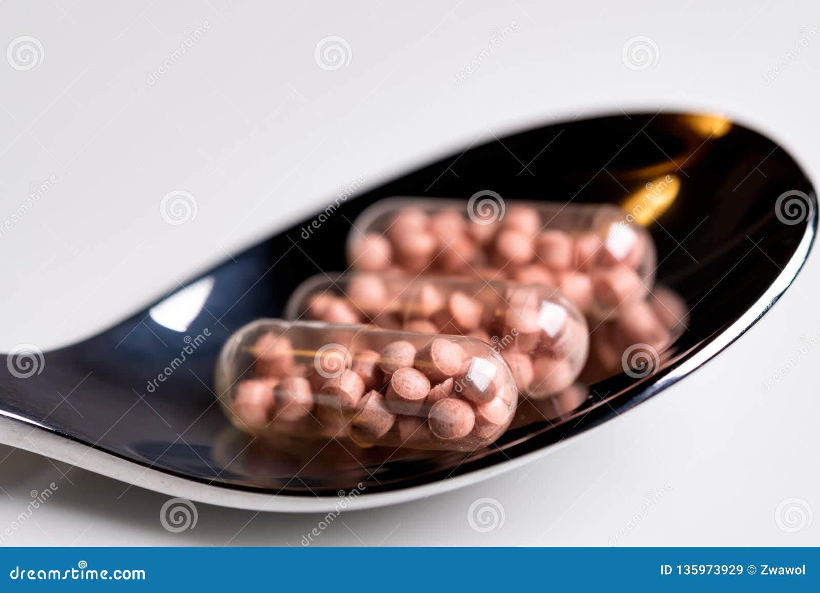 Tablets on a spoon stock image. Image of pharmacist - 135973929