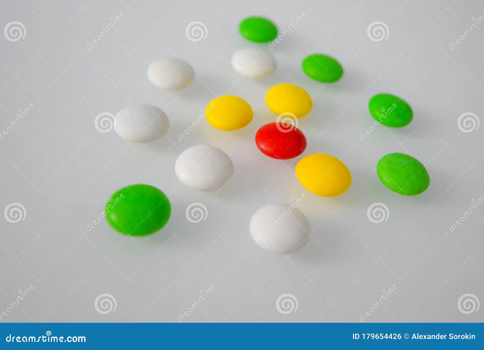 Tablets or Sweets, White and Colored on a White Table Stock Photo ...