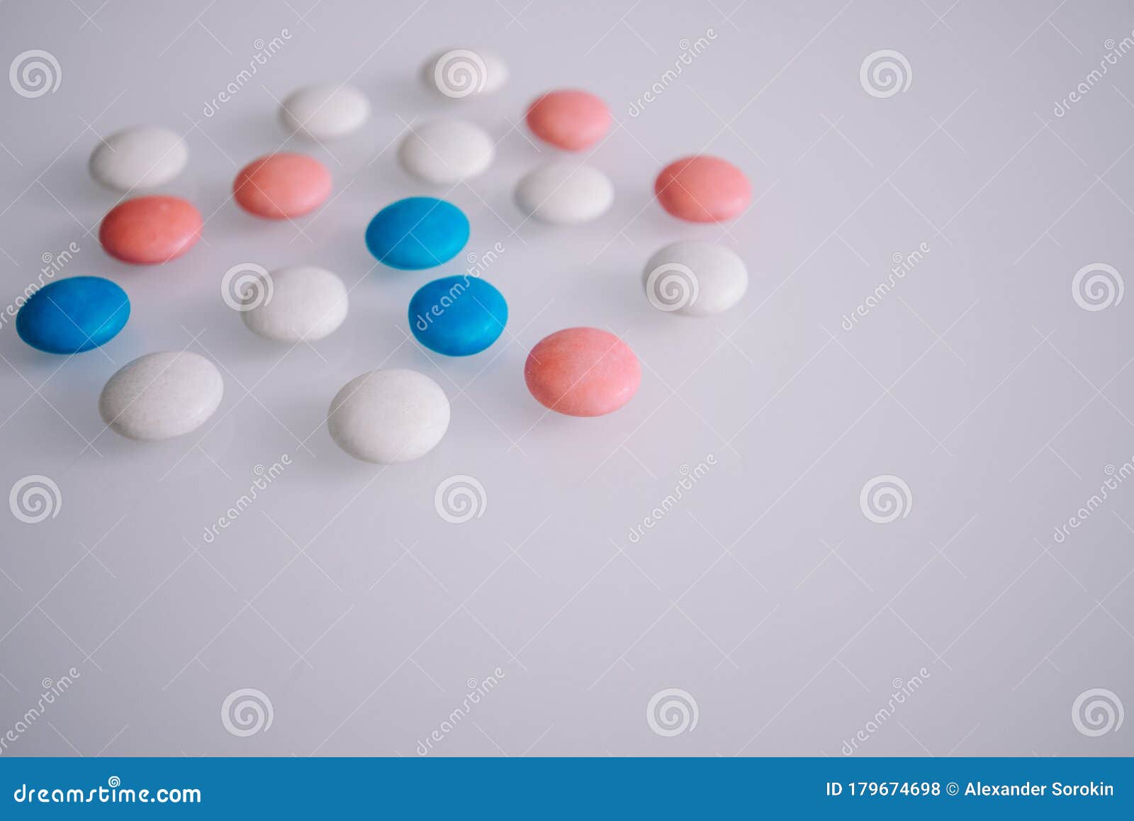 Tablets or Sweets, White and Colored on a White Table Stock Photo ...