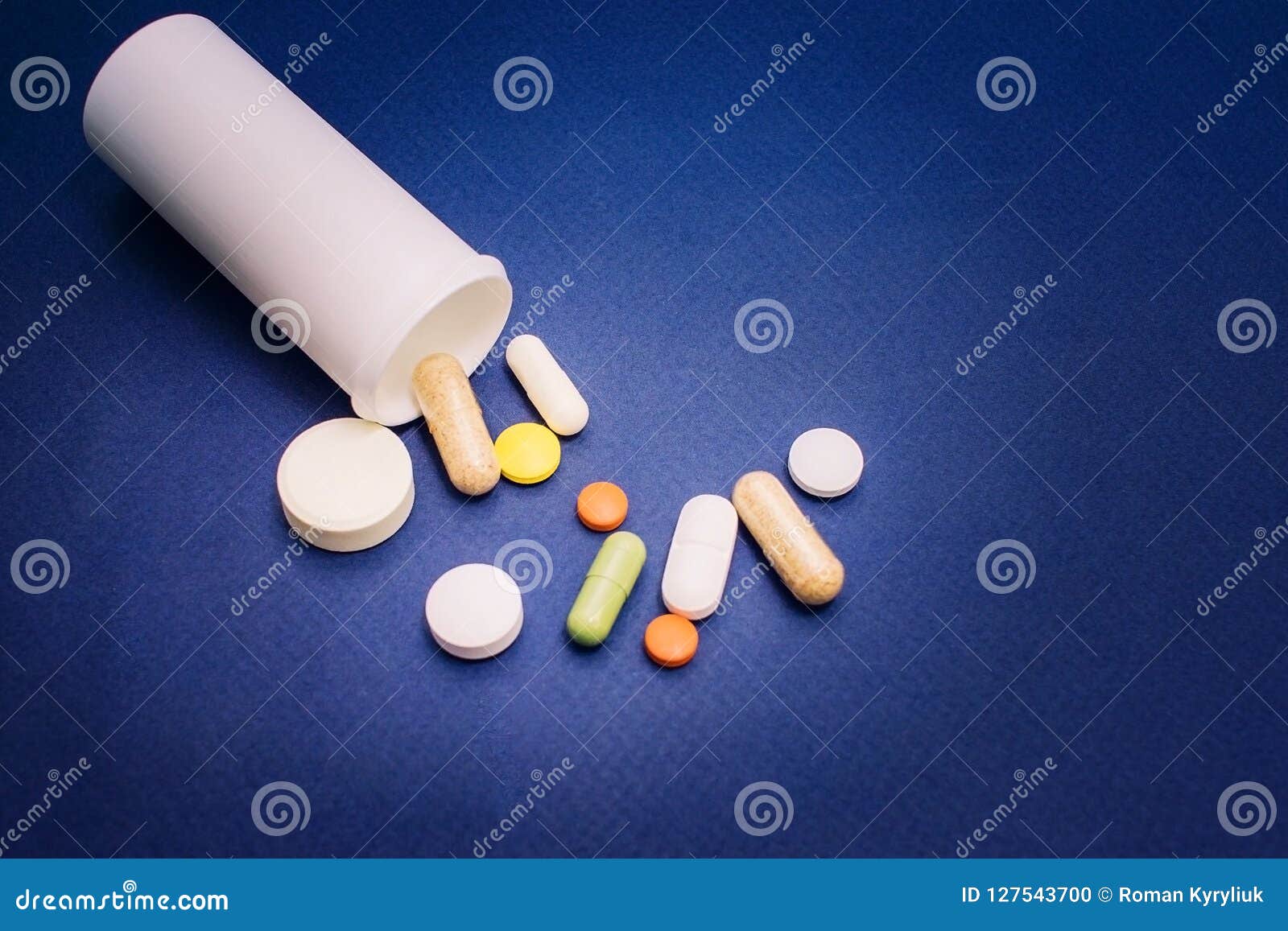 Tablets from a Vial on a Blue Background Stock Photo - Image of drug ...