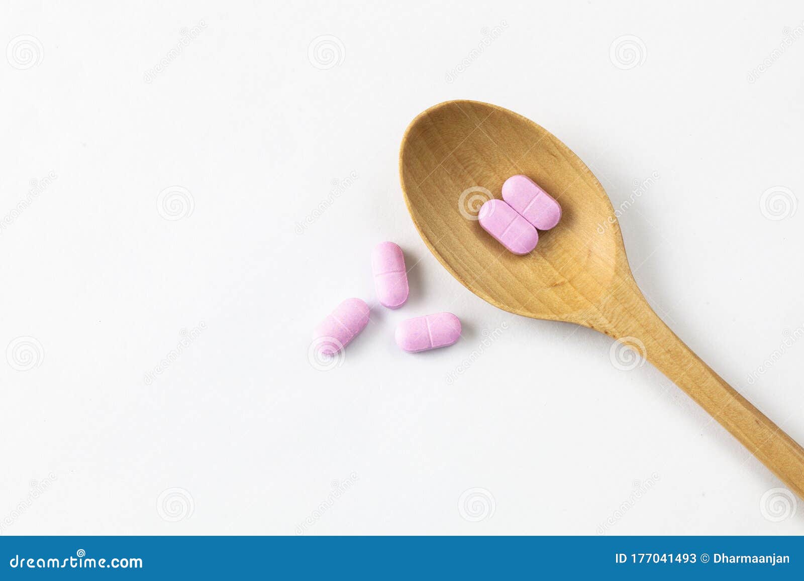 Tablets on wooden spoon stock image. Image of fever - 177041493