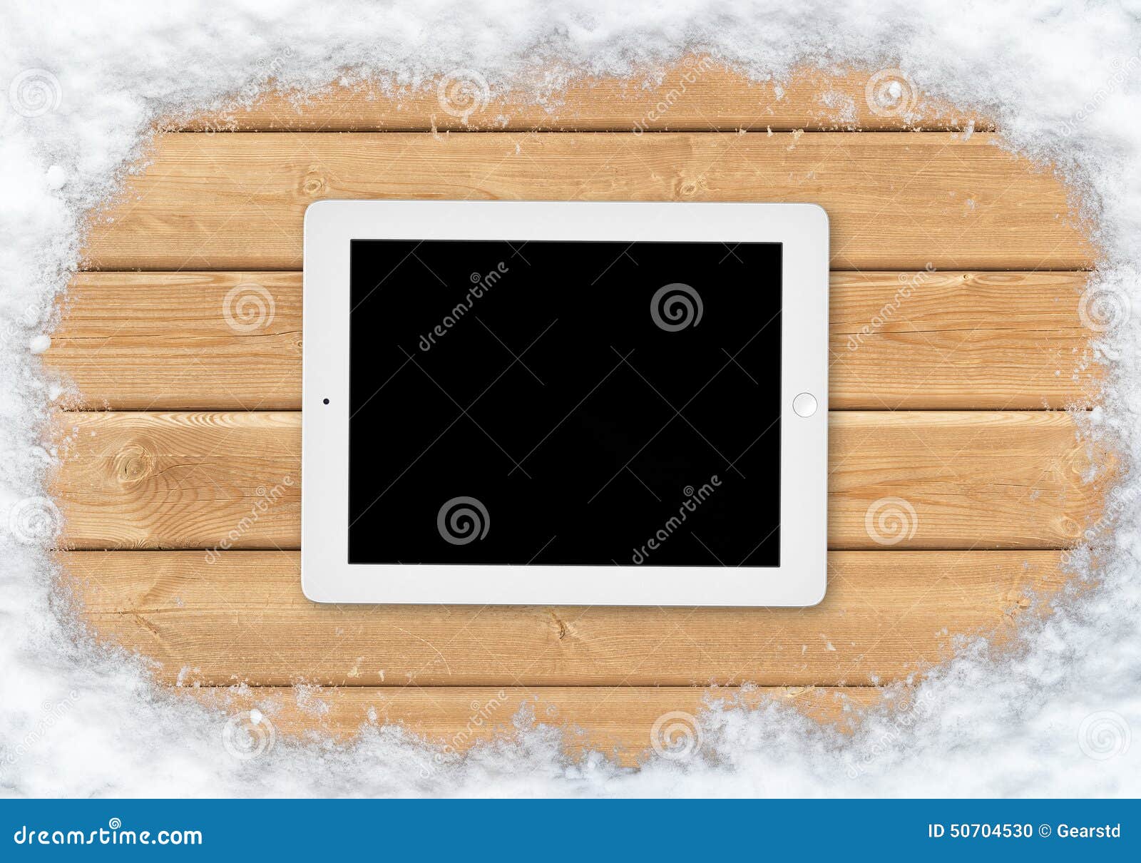 Tablette Sur Une Surface Couverte De Neige Photo stock - Image du place ...