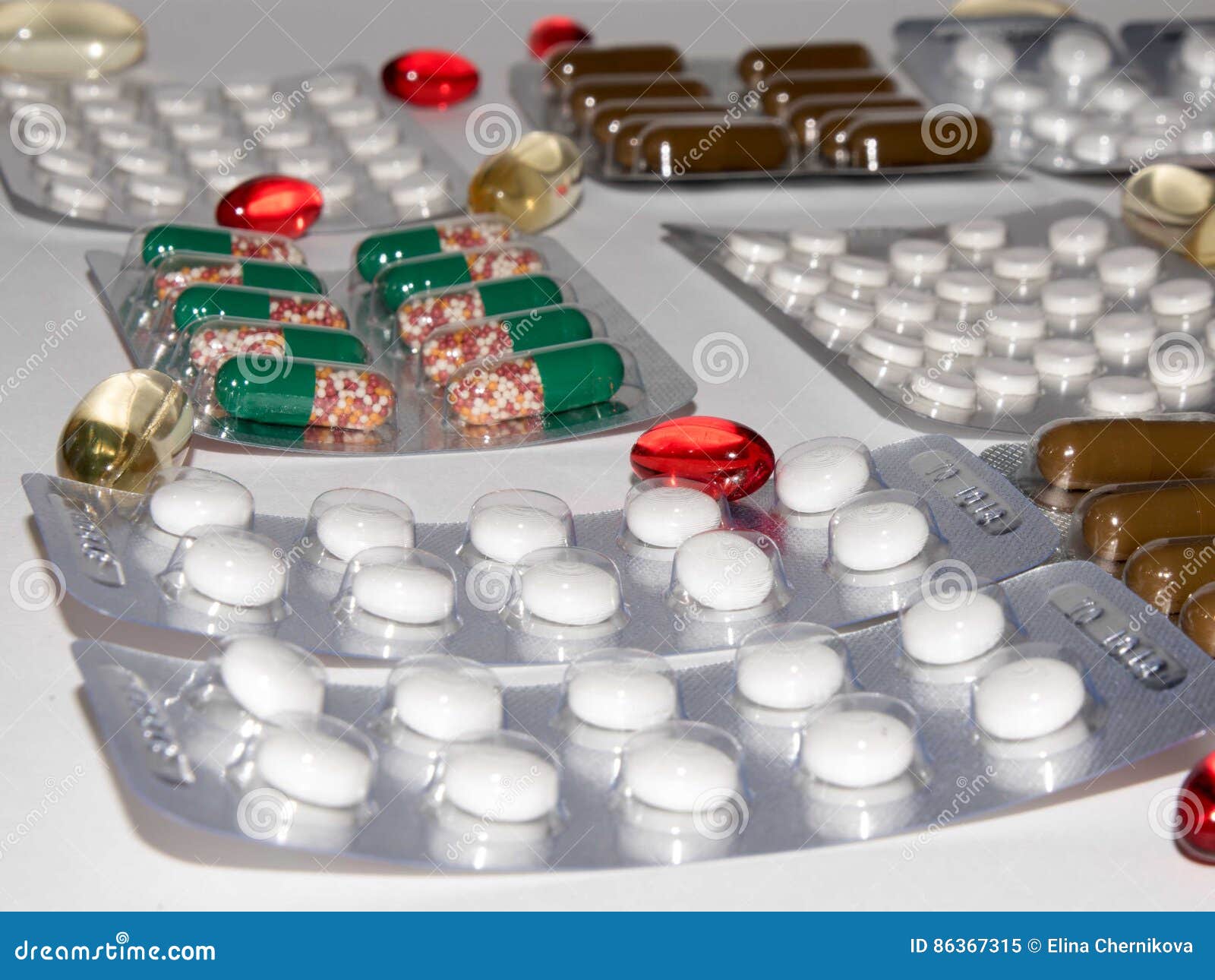 Tabs Vitamins, Omega 3, Medications Tablets and Capsules in a Beaker ...