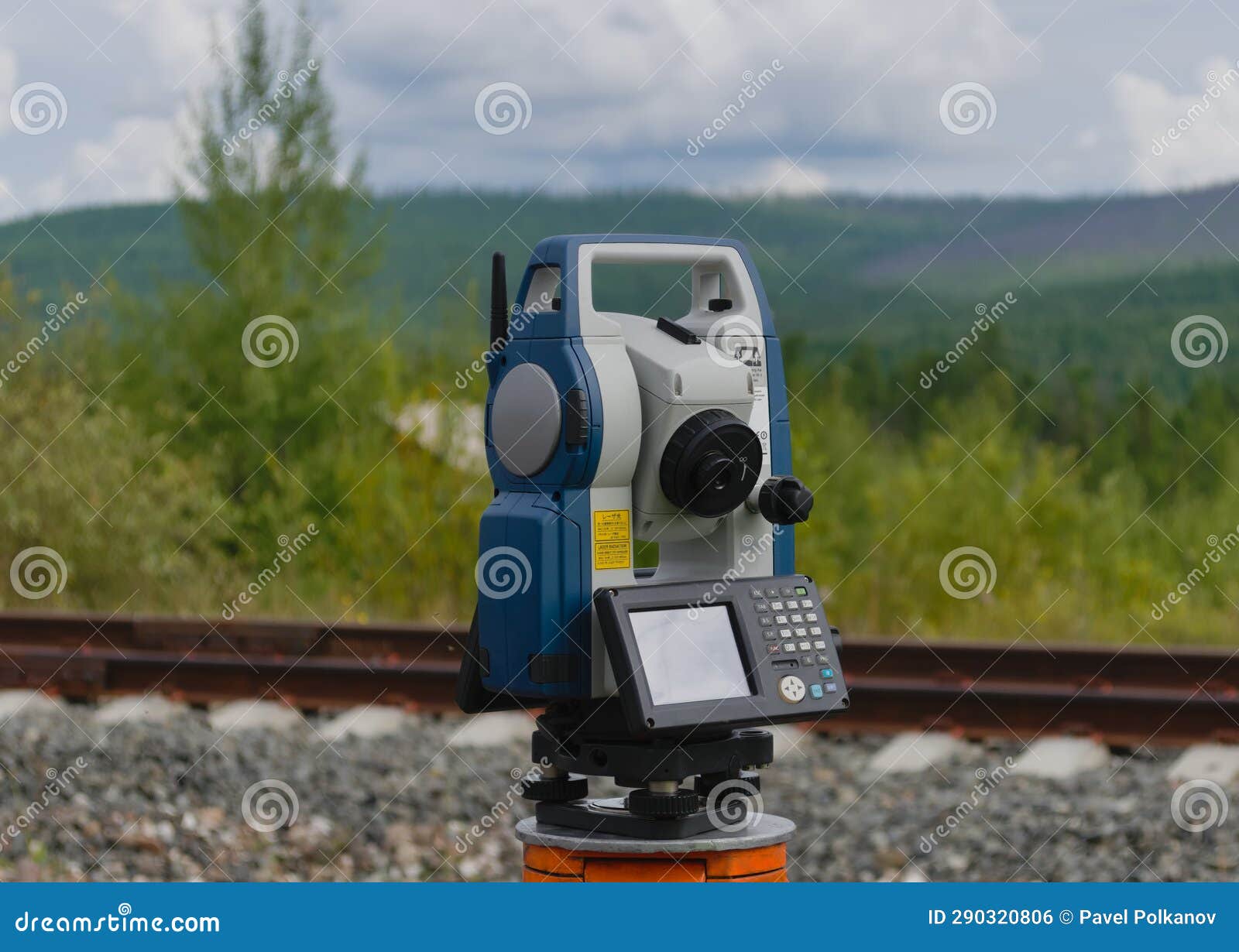 Tachymeter Making Geodetic Survey with Summer Forest at the Background ...
