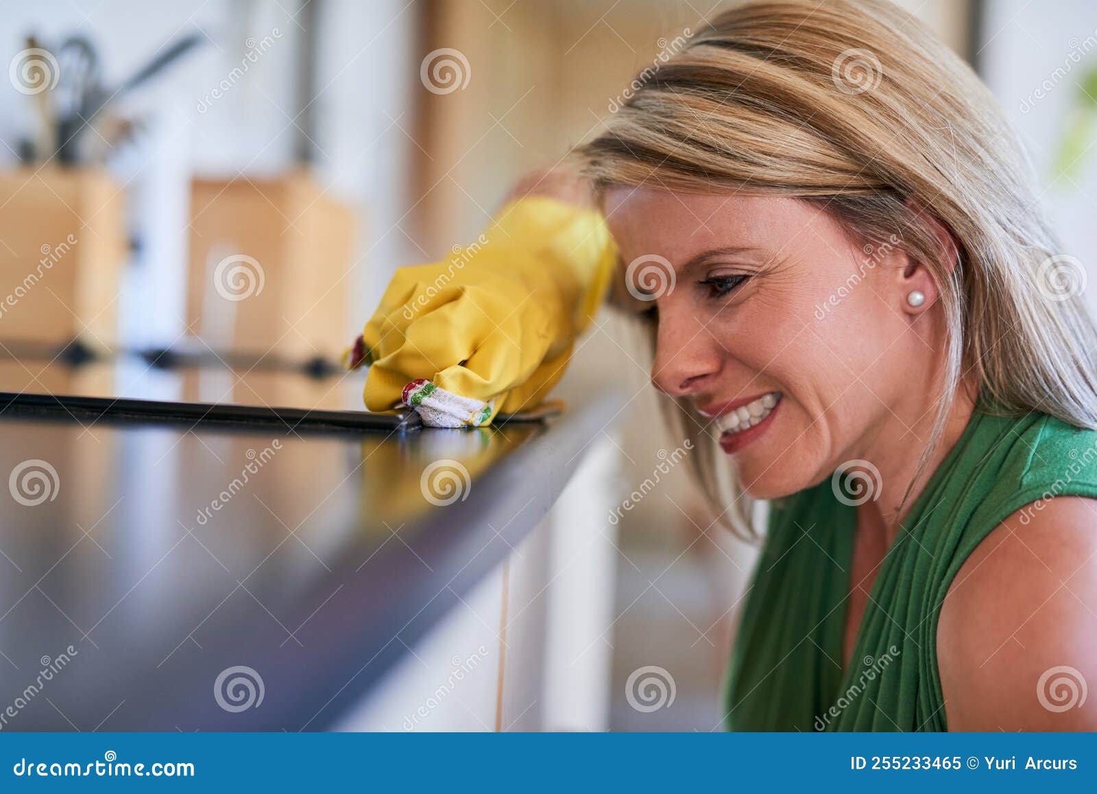 Tackling Kitchen Tasks. a Young Woman Cleaning a Kitchen Surface. Stock ...