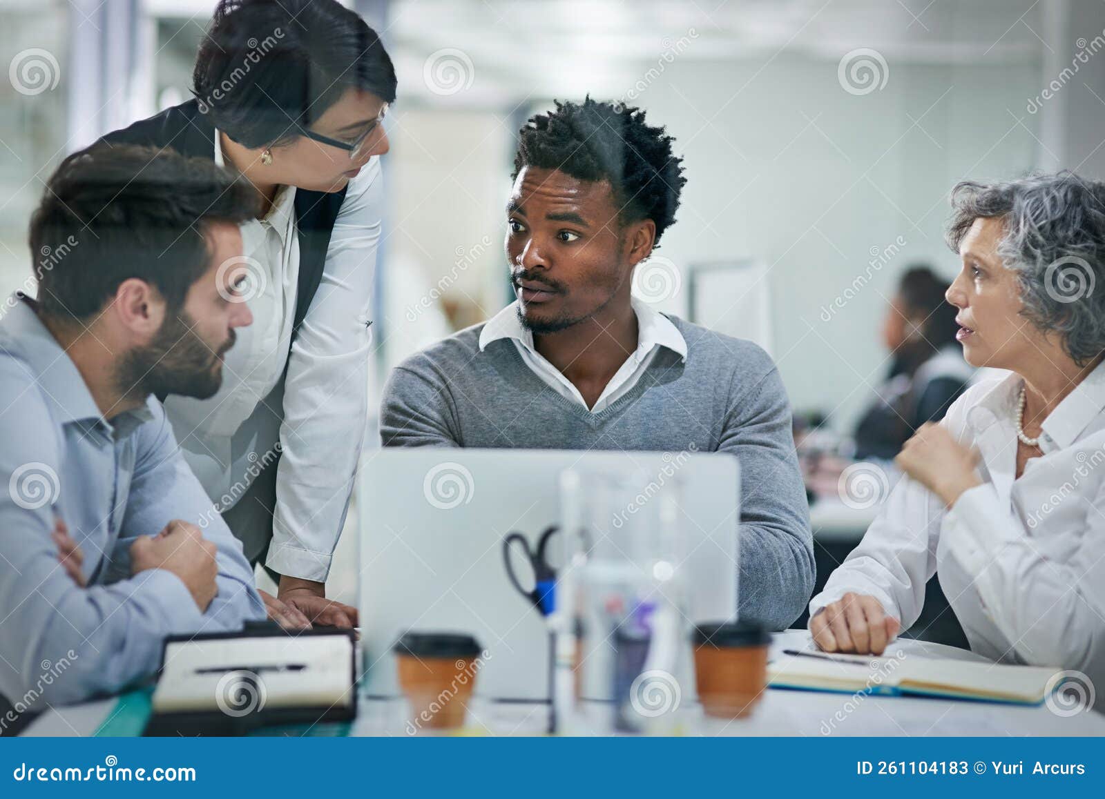 Tackling the Task at Hand. a Group of Colleagues Brainstorming Together ...