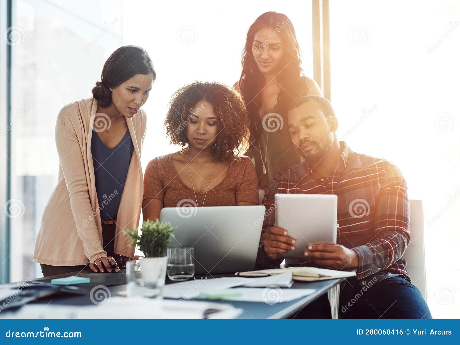 Tackling Their Latest Project As a Team. a Group of Young Professionals ...