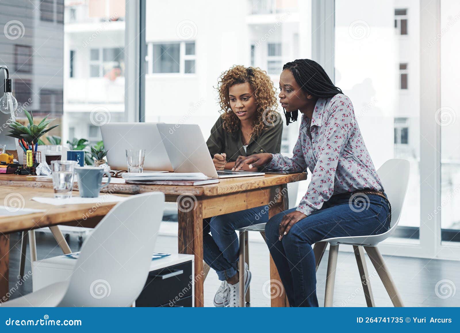 Tackling Their Work Task with Twice the Expertise. Two Young Colleagues ...