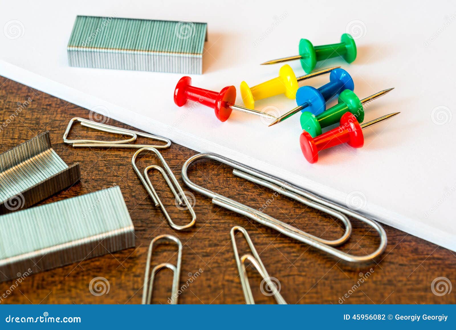 Tacks, Clips and Paper on the Table Stock Photo - Image of personal ...