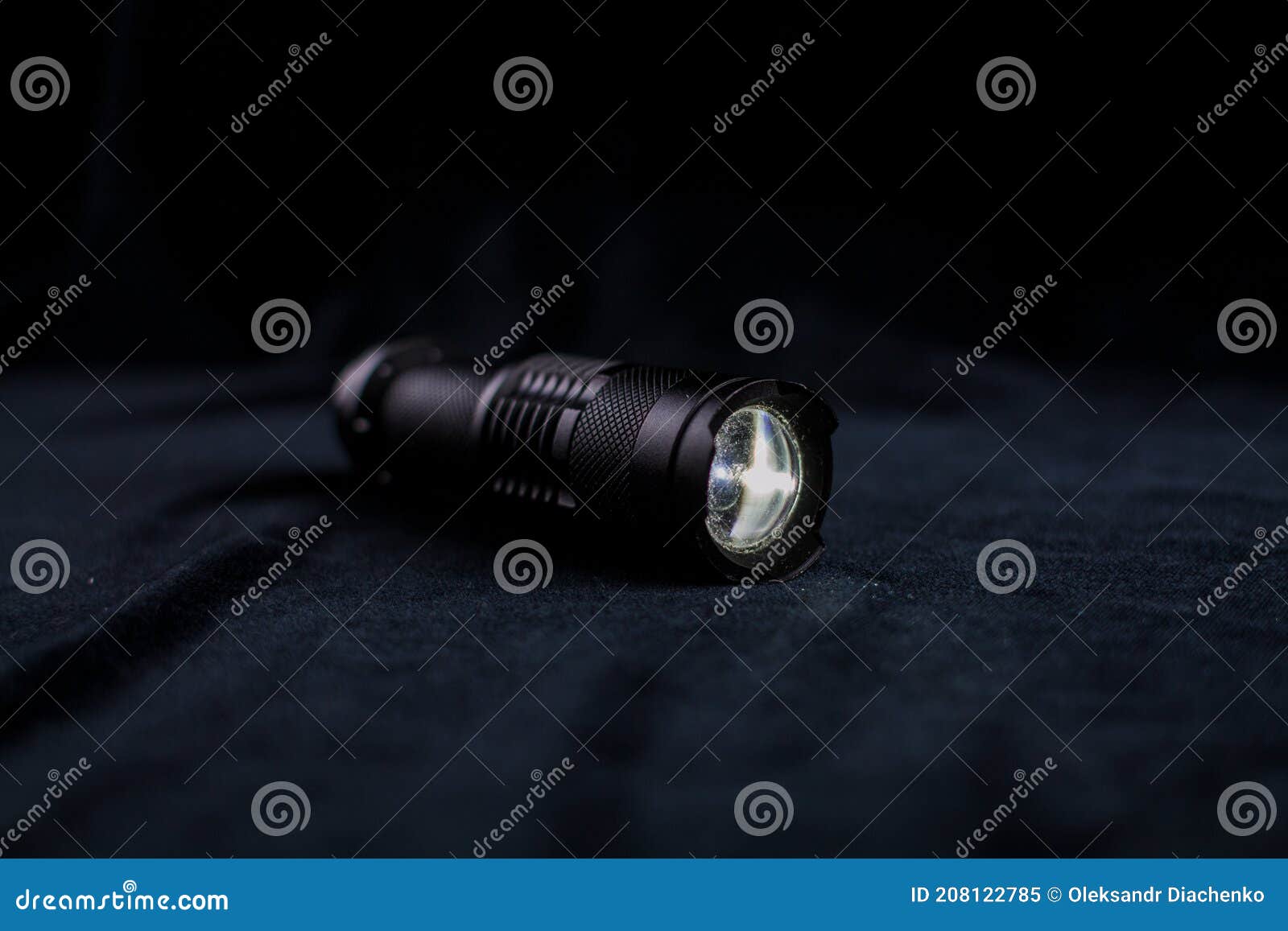 Tactical Flashlight on a Black Background Shines Stock Image - Image of ...
