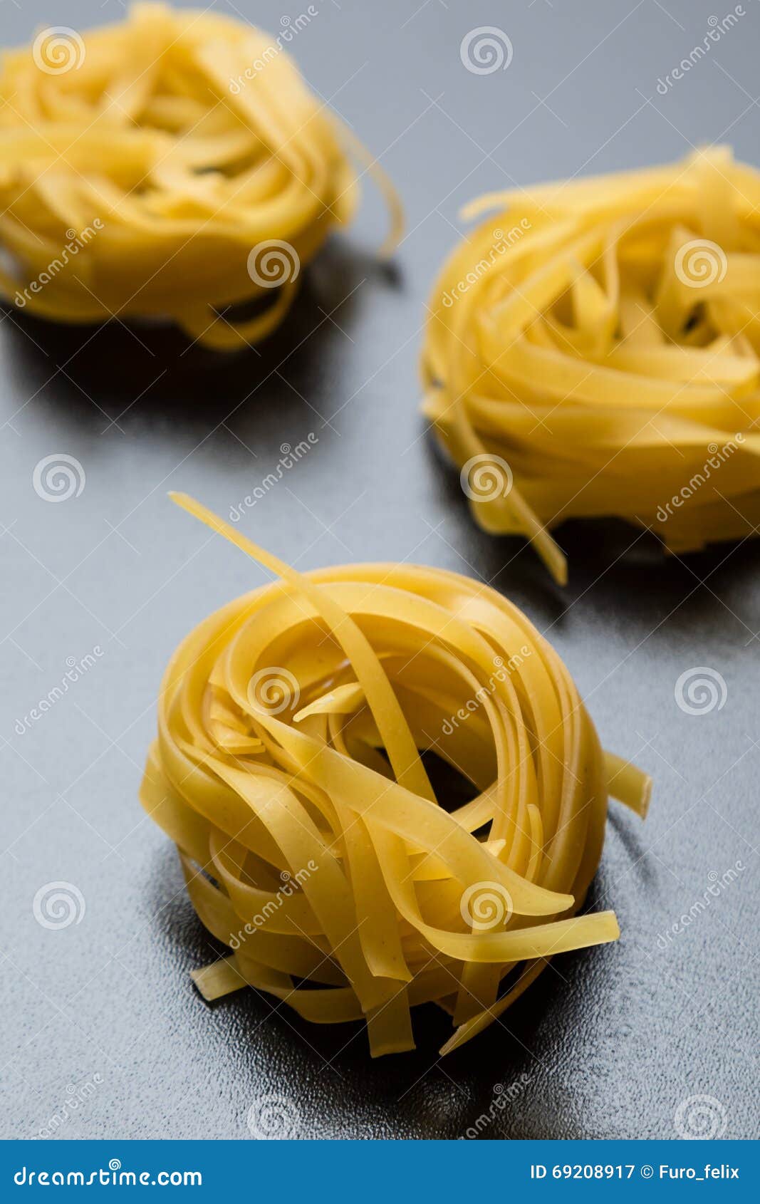 Tagliatelle on black table stock image. Image of rolled - 69208917