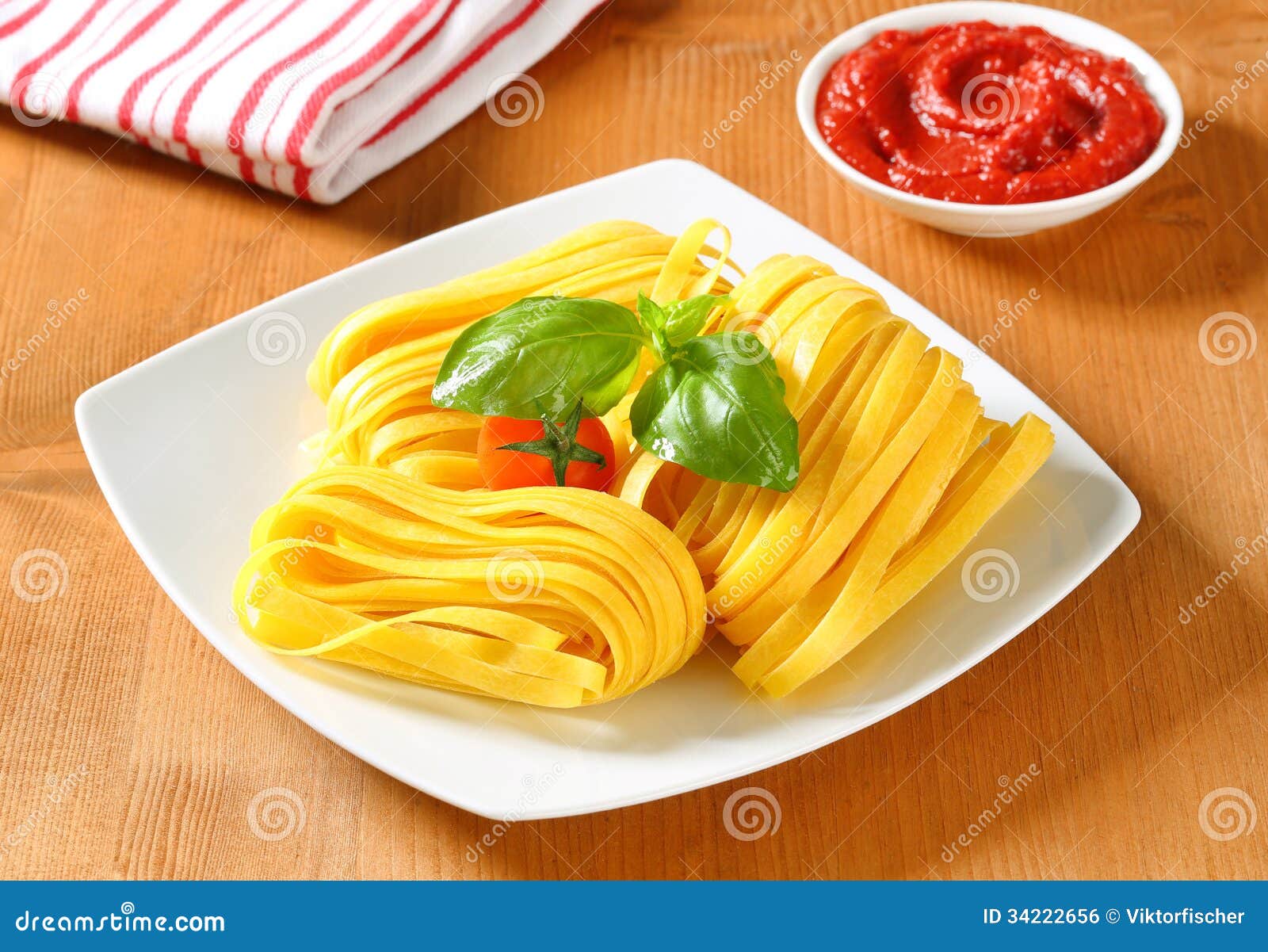 Tagliatelle Pasta and Tomato Paste Stock Photo - Image of dried, long ...