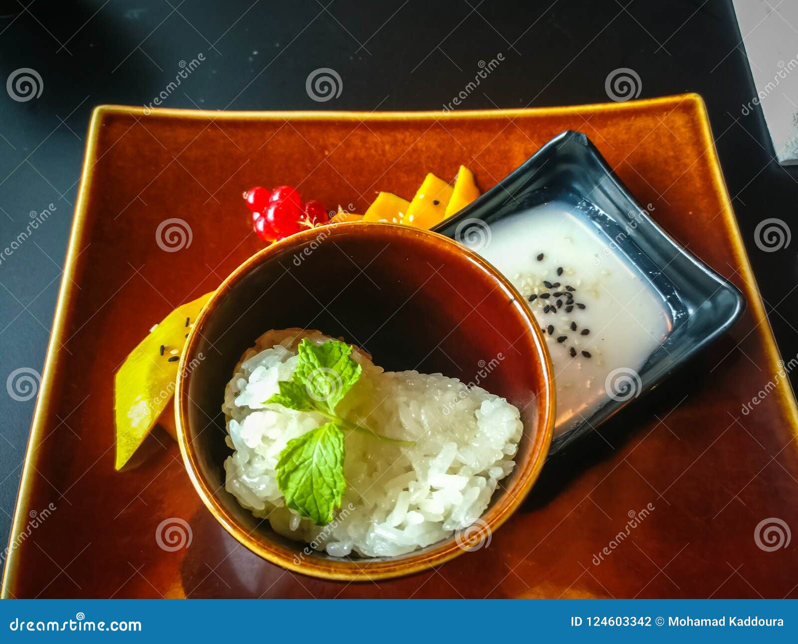 Tai Dessert. Enjoying a Delicious Rice, Mango, and Yogurt Dessert Stock ...