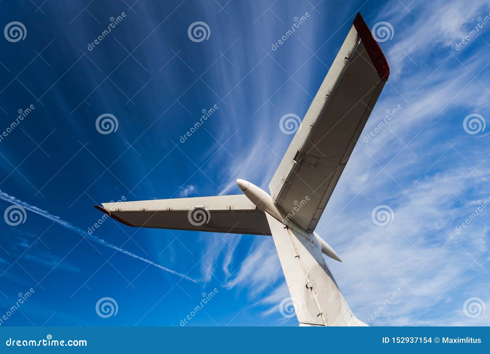 Tail of Aircraft. White Tail of Aircraft on Blue Sky Background. Stock ...