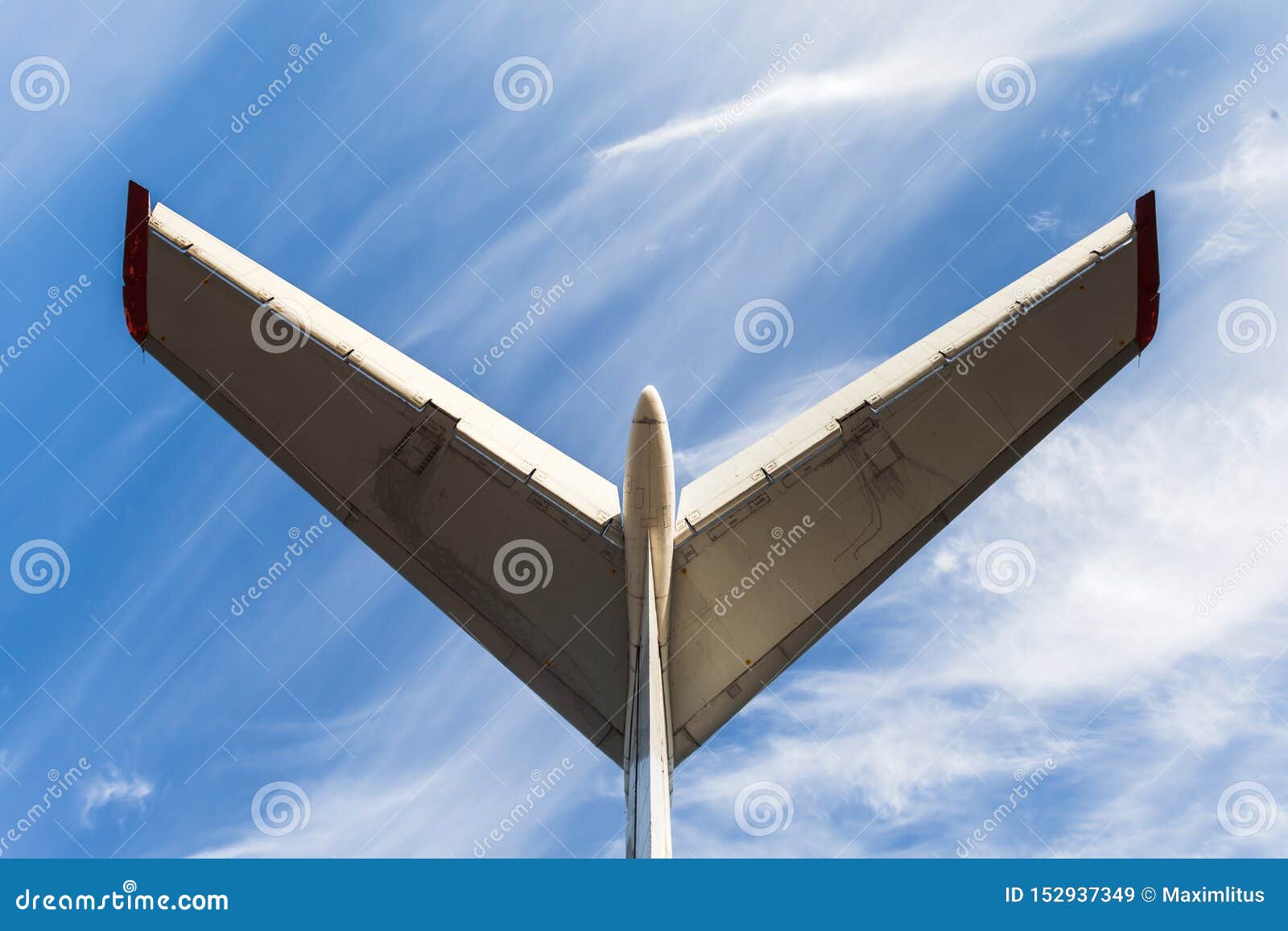 Tail of Aircraft. White Tail of Aircraft on Blue Sky Background. Stock ...