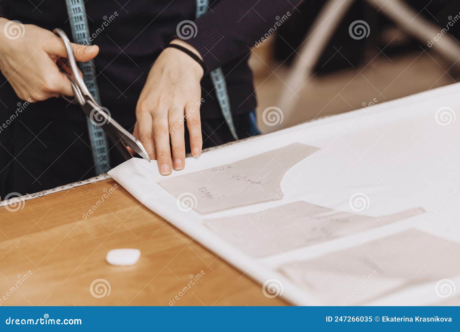 The Tailor Cuts Out the Fabric According To the Pattern Stock Image ...