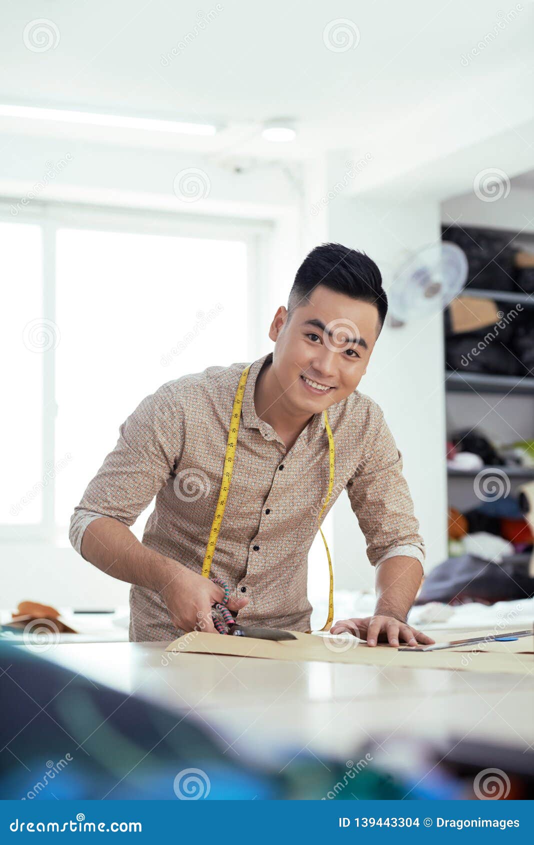 Tailor Cutting Dress Pattern Stock Photo - Image of handsome, portrait ...