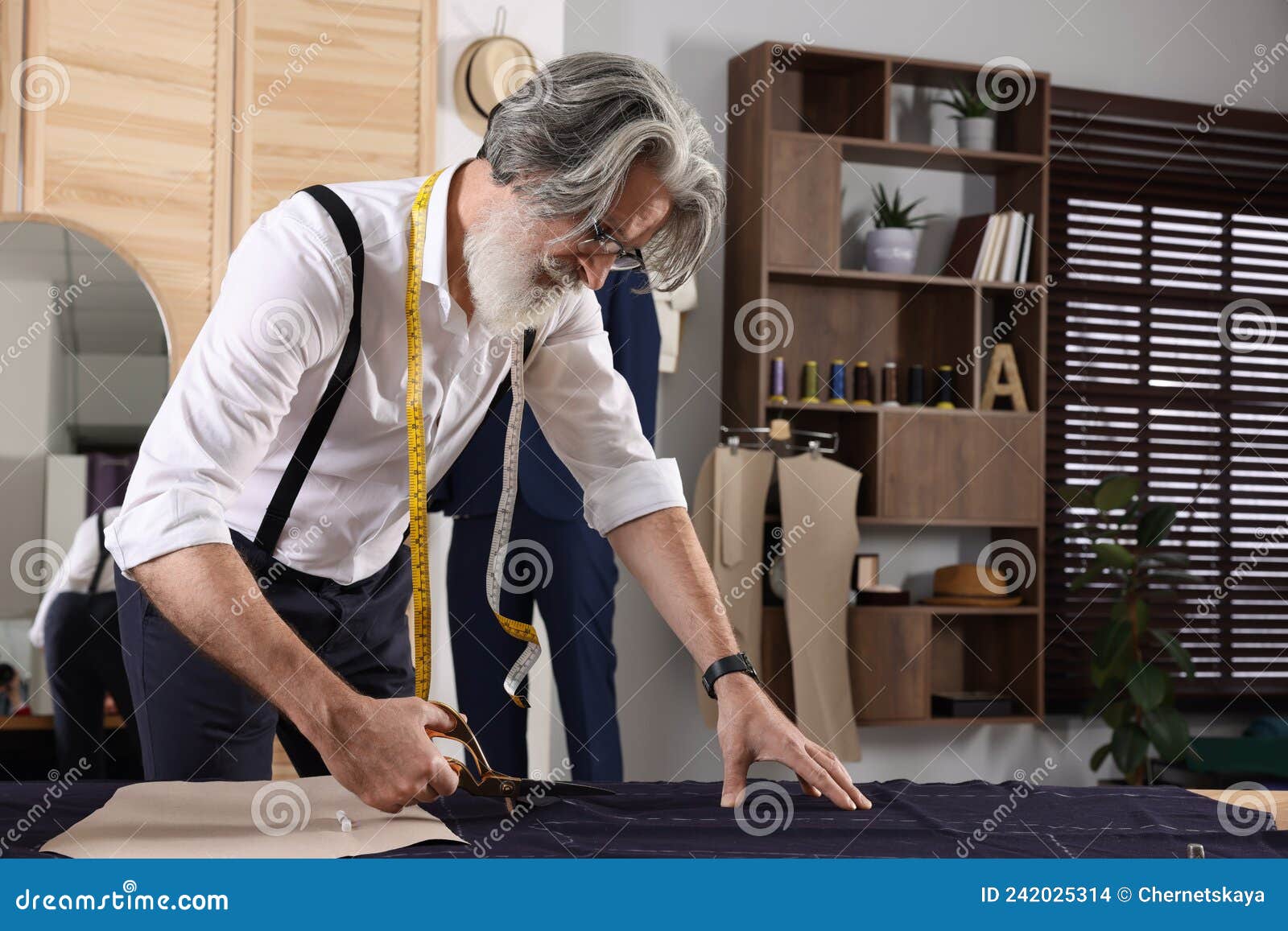 Professional Tailor Cutting Fabric by Following Chalked Sewing Pattern ...