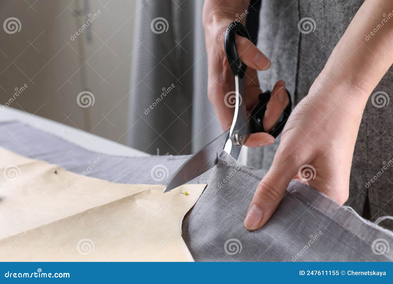 Tailor Cutting Fabric with Scissors at Table in Atelier, Closeup Stock ...