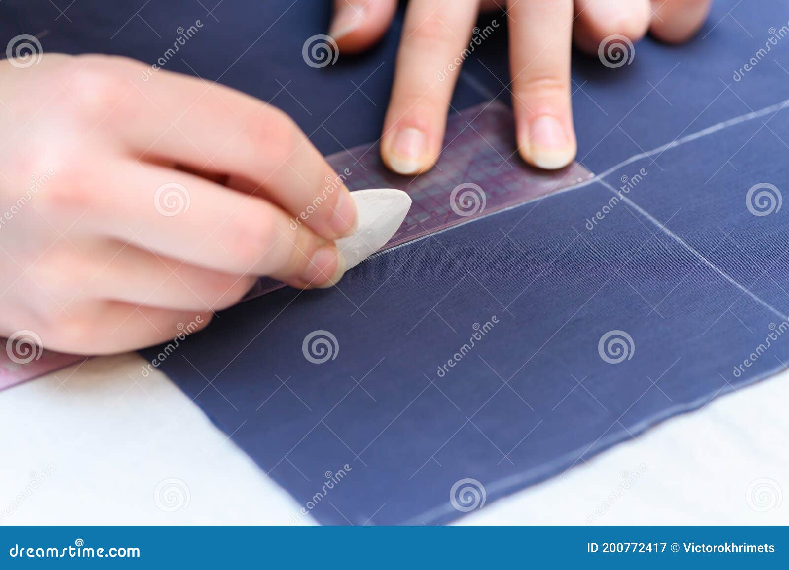 A Tailor Hand Marks Line on the Fabric with Chalk for Cutting a Garment ...